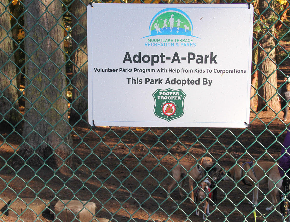 Adopt a Park Sign with Dogs in back - Pooper Trooper